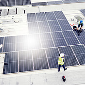Solar energy, construction and employees building solar panels in ...