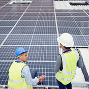 Solar energy, construction and employees building solar panels in ...