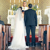 Wedding, priest and couple at the altar for marriage vows in commitment ...