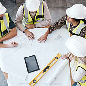 Above, blueprint and architects planning design of house during meeting ...