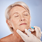 Botox, doctor hands and senior woman face for collagen, skincare and ...