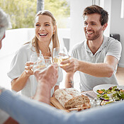 Family toast, drink celebration or birthday lunch with smile, happy or ...