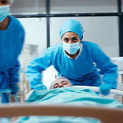 Surgeon, bed and rush in a hospital for emergency operation in the er ...