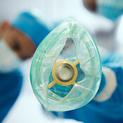 Closeup oxygen mask, ventilation and doctors in hospital of emergency ...