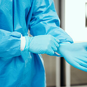 Healthcare, scrubs and surgeon hands with gloves for protection in ...