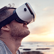 VR, beach and metaverse with a man outdoor in a nature using a wireless ...