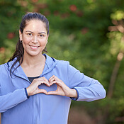 Cardiovascular, woman with hands in heart shape and fitness with health ...