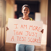 Education, protest and student with a poster at a college for ...