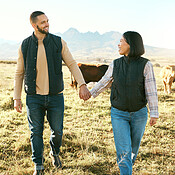 Farmer couple, cattle farming and happy while holding hands and walking ...