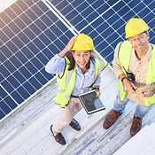 Solar panels, digital tablet and top view of team doing maintenance ...