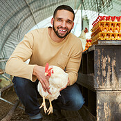 Chicken farmer, poultry farming and man with animals, smile and ...