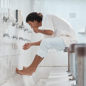 Islam, ablution and man washing before prayer in bathroom at mosque in ...