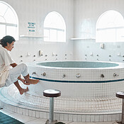 Islam, ablution and man washing before prayer in bathroom at mosque in ...