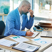 Burnout, laptop or corporate black man with headache in office with tax ...