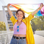 Portrait, pride and lesbian woman with flag on city bridge, lgbtq ...