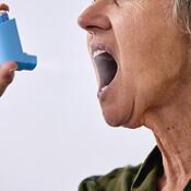 Asthma, oxygen and senior woman with a pump for breath, medical help ...