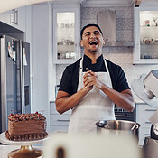 Man, baker and laughing in kitchen on vlog, live streaming and ...