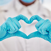 Healthcare, heart or hands and a doctor in a hospital with gloves ...