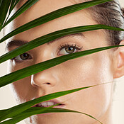 Woman, face and beauty with leaf in skincare for cosmetics or healthy ...