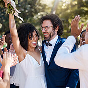 Happy bride and groom celebrate wedding with excited and cheerful ...