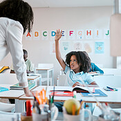 Question, school and education with a black girl student hand raised in ...