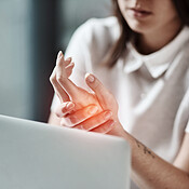 Feeling the strain on the tendons of her wrists and hands | Buy Stock ...