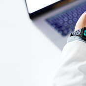Doctor hands, smartwatch and closeup in office by laptop for health ...