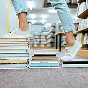 Woman feet, book steps and library for symbol of progress in learning ...
