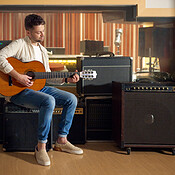 Recording studio, acoustic and man playing the guitar for music ...