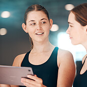 Sports, tablet and team talking, workout plan and research for routine ...