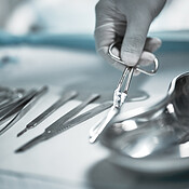 Healthcare, surgeon and medical instruments for surgery in a ER or ...