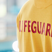 Lifeguard, closeup and swimming pool safety at indoor facility for ...