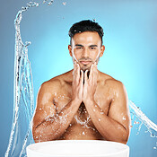 Water splash, face and man with basin for beauty, skin and skincare ...
