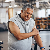 Sports, gym and injury, old man with arm pain, emergency during workout ...