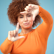 Hands, frame and portrait of black woman on blue background for profile ...