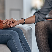 Woman, holding hands and closeup for therapy consultation, support and ...