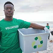 Cleaning, recycling and portrait of black man on beach for ...