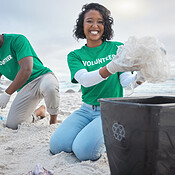 Teamwork, cleaning and volunteer with people on beach for ...