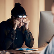 Stress, headache and business black woman at night working on project ...