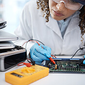 Computer hardware, diagnostic and black woman electrician working on ...