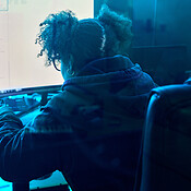 Computer hacker, night and neon woman hacking database software, online server or programming ...