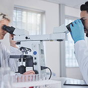Research, microscope and science people teamwork, medical analysis and ...
