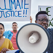 Climate change sign, protest and black man with megaphone for freedom ...