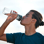 Fitness, drinking water and man with training, exercise and workout for ...