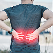 Back pain, red fitness and man running exercise or sports injury ...