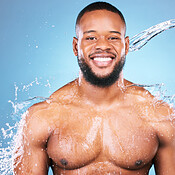 Bodybuilder, happy and water splash for man cleaning, hygiene and ...
