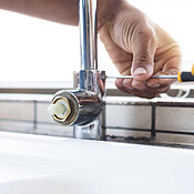 Plumber man, tap and hands with screw tools of building maintenance ...