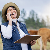 Veterinarian, phone call or happy woman laughing on farm to check ...