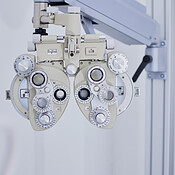 Phoropter, medical optometry and equipment in hospital for eye test or ...