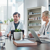 Meeting, team and doctors in discussion in the hospital conference room ...